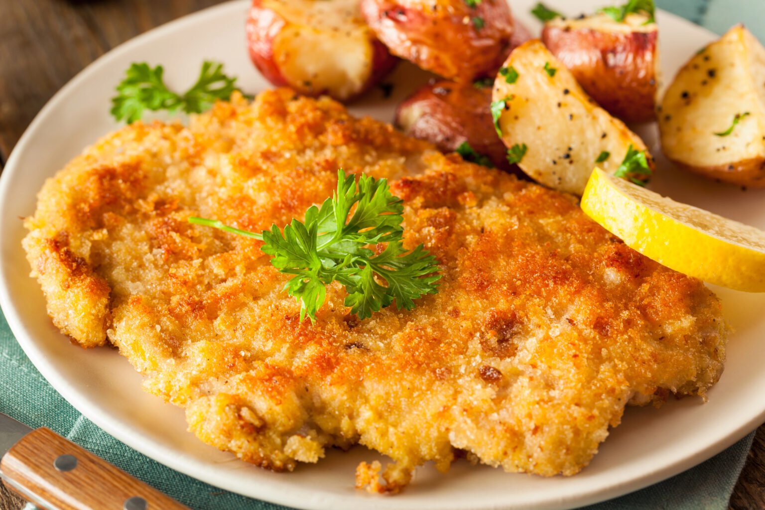 Crispy Breaded Pork Schnitzel Recipe - saucefreaks.com